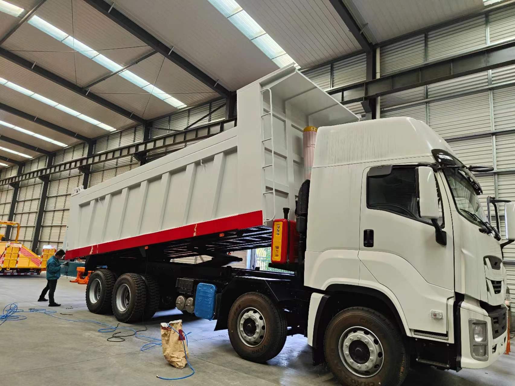 12 UNITS ISUZU TRUCK CHASSIS ARE BEING INSTALLED THE DUMPER BOXES ...